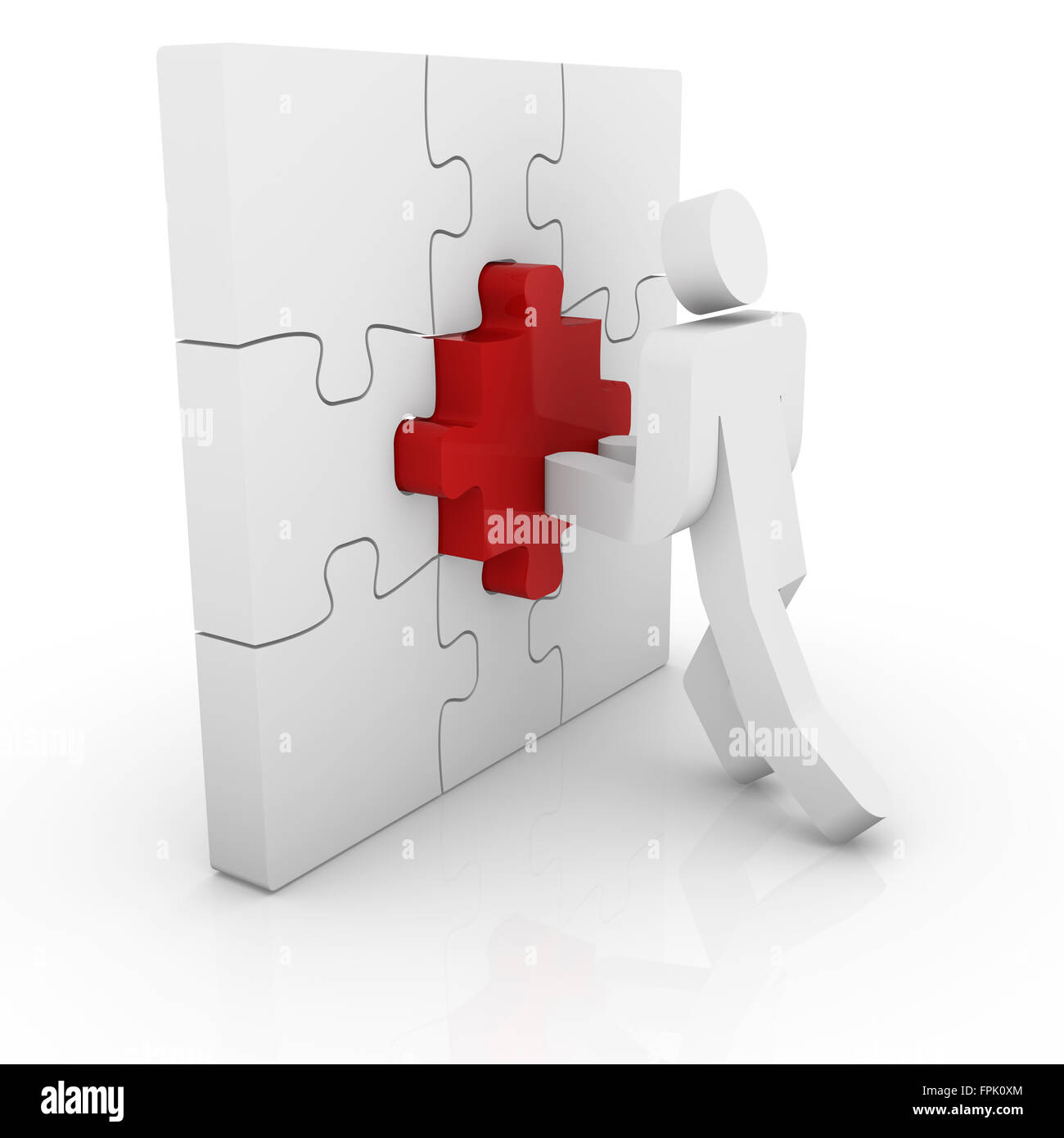 Man pushing a puzzle piece Stock Photo - Alamy