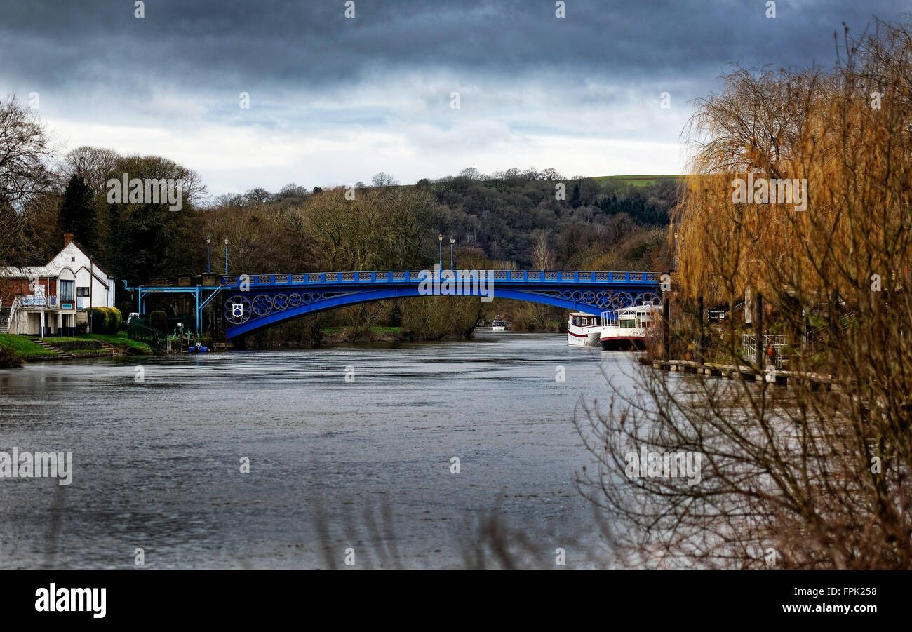 The arched blue bridge built in 1787 that crosses the wide River Severn ...