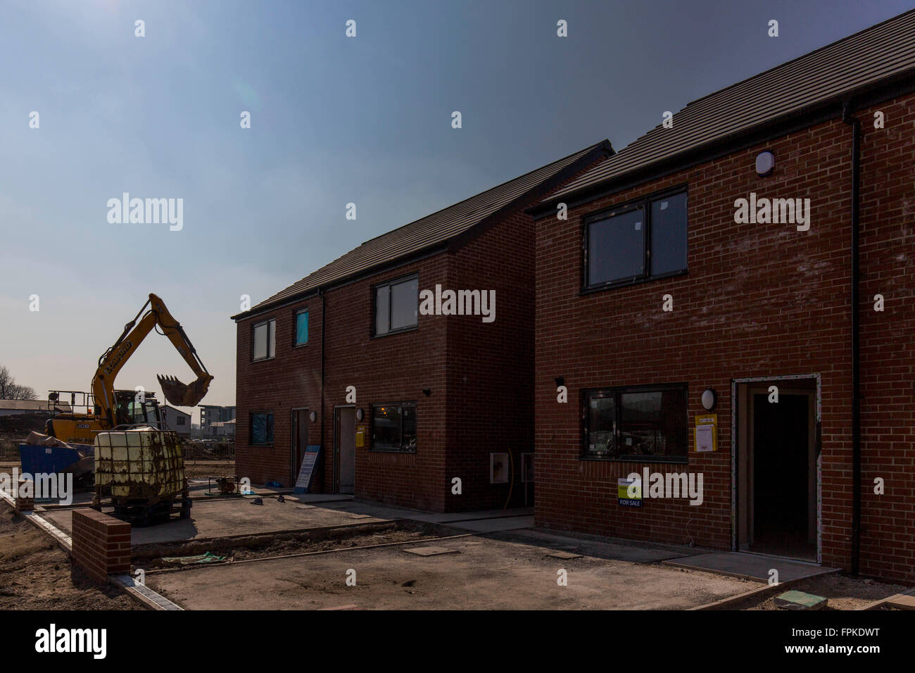 a housing building site - affordable homes being built Stock Photo - Alamy