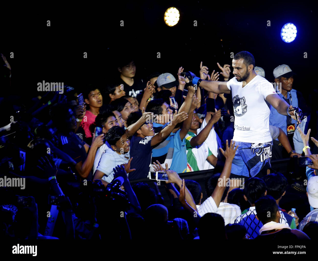 Yangon, Myanmar. 18th Mar, 2016. Egyptian Mohamed Ali greets the ...