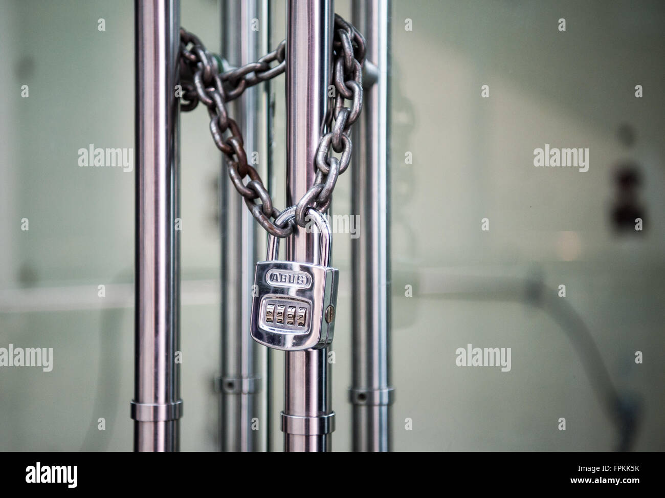 Thick chains lock the doors of an empty shop at the multi-storey ...