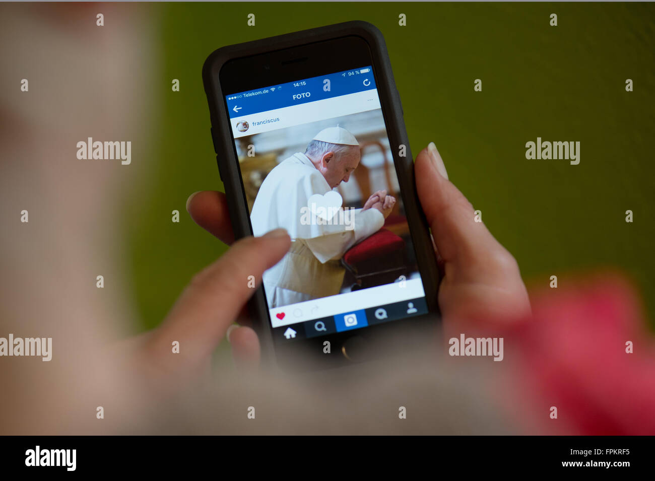 ILLUSTRATION - A woman holding a smartphone that shows the Instagram ...