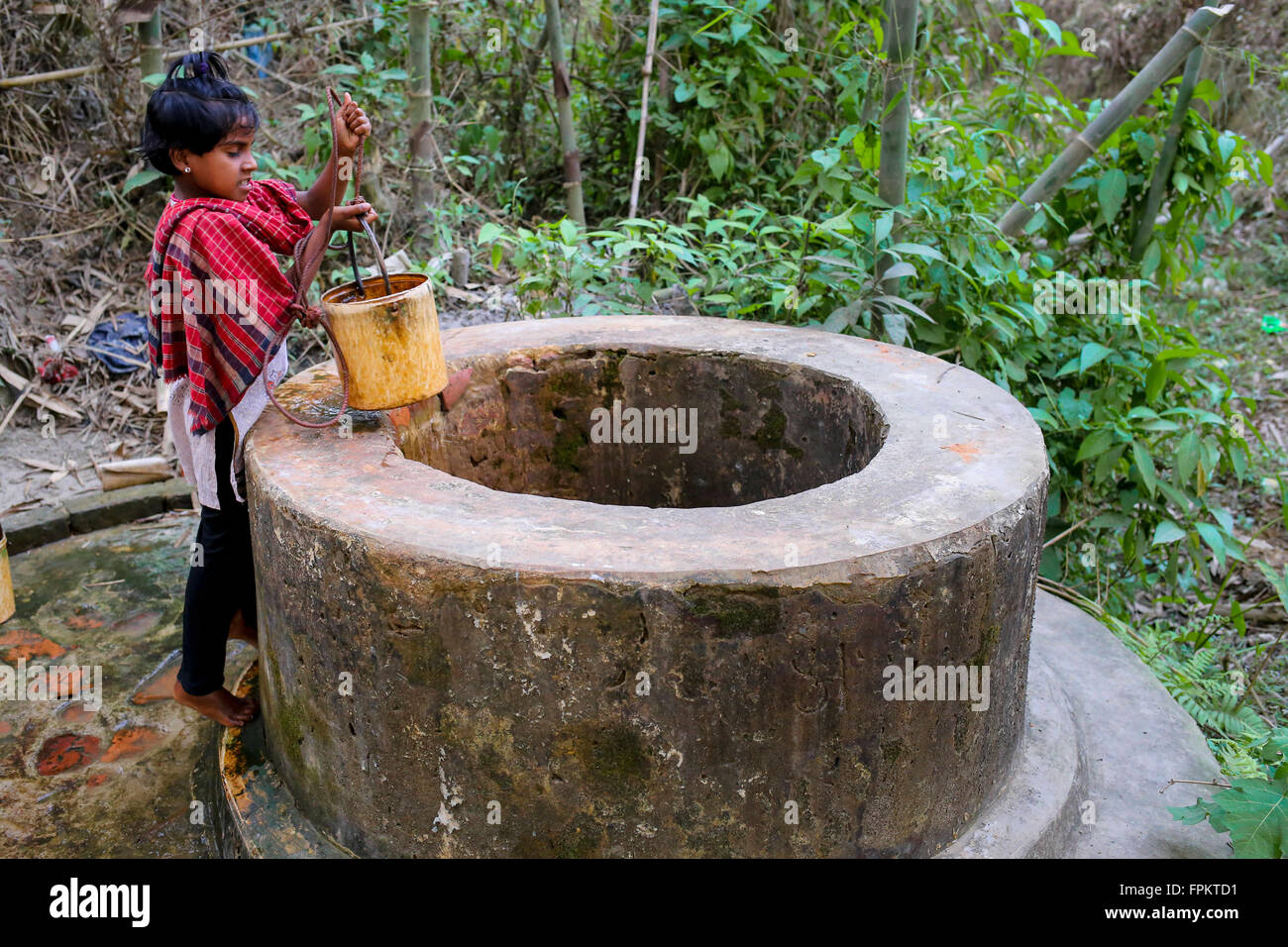 Children collecting water from well hi-res stock photography and images ...