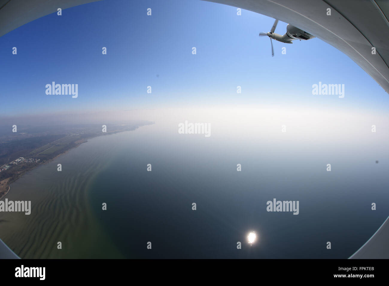A flight with a zeppelin above Bodensee lake near Friedrichshafen ...
