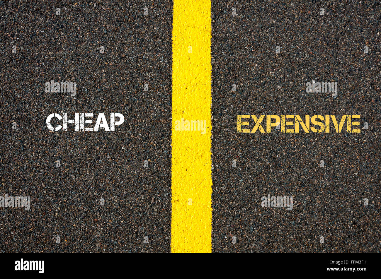 Antonym concept of CHEAP versus EXPENSIVE written over tarmac, road ...