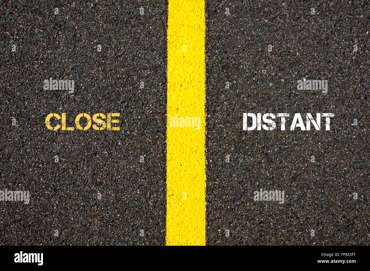 Antonym concept of CLOSE versus DISTANT written over tarmac, road ...