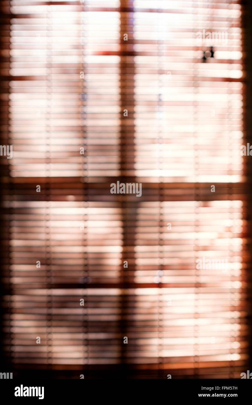 Out of focus blind on a window, backlit by sunlight Stock Photo - Alamy
