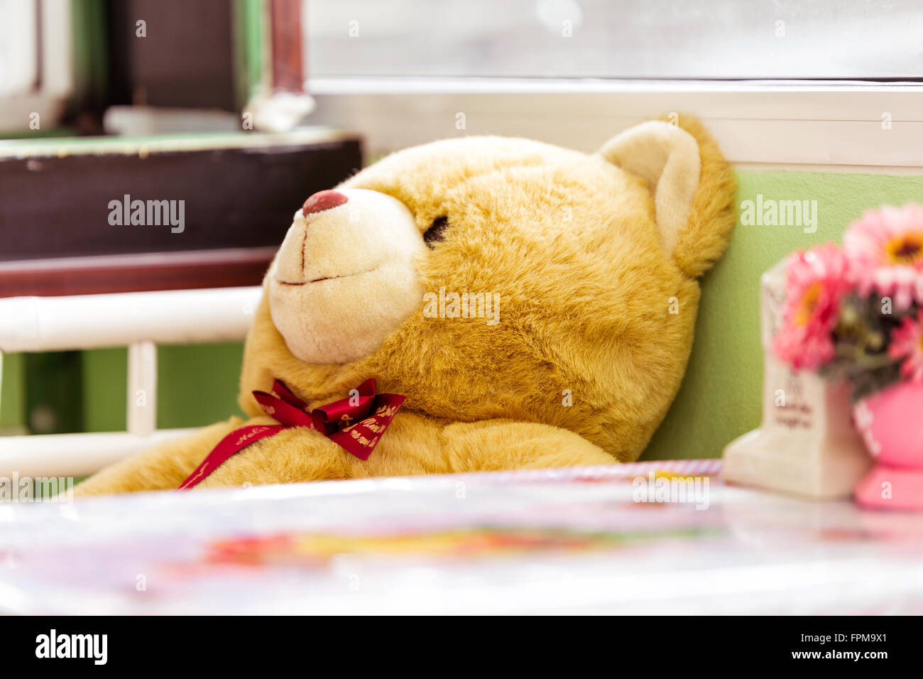Teddy bear sitting on chair hi-res stock photography and images - Alamy