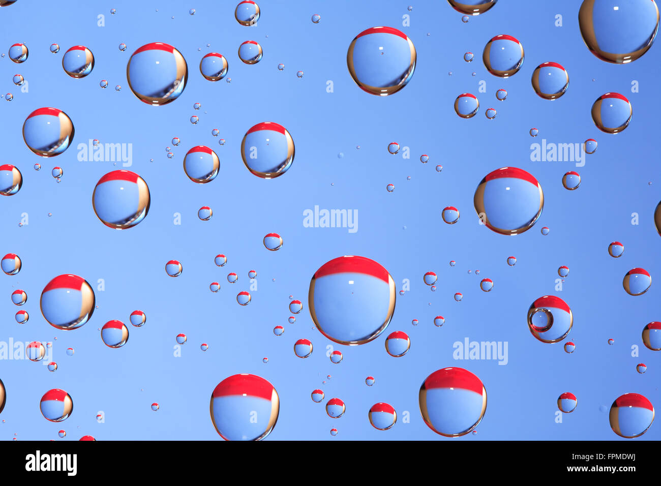 Abstract blue background with various colorful water drops Stock Photo ...