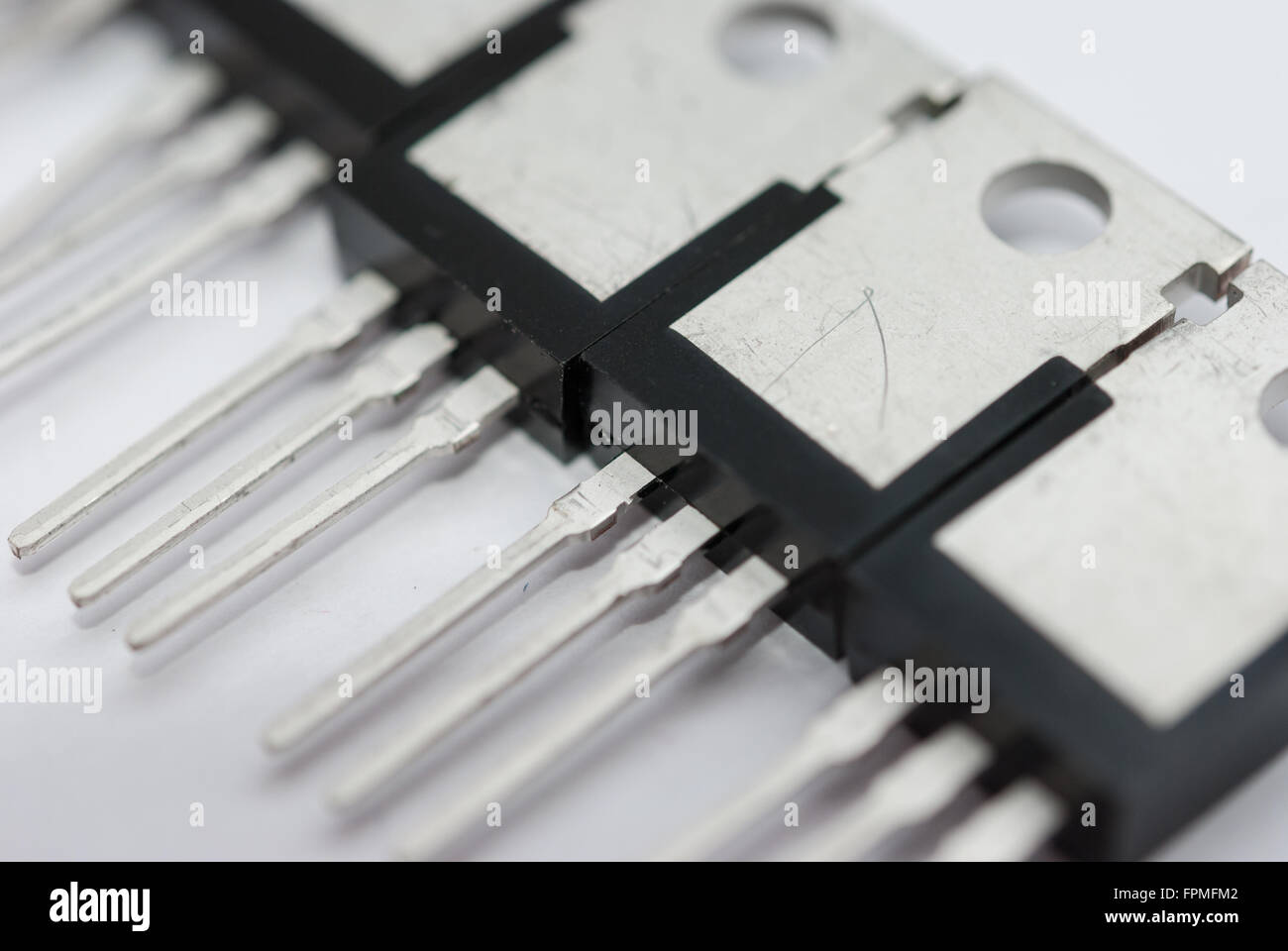 Power transistors on the white background closeup Stock Photo - Alamy