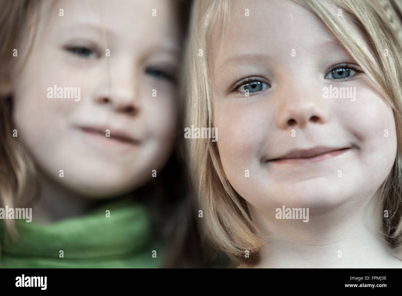 2 girls smiling into camera Stock Photo - Alamy