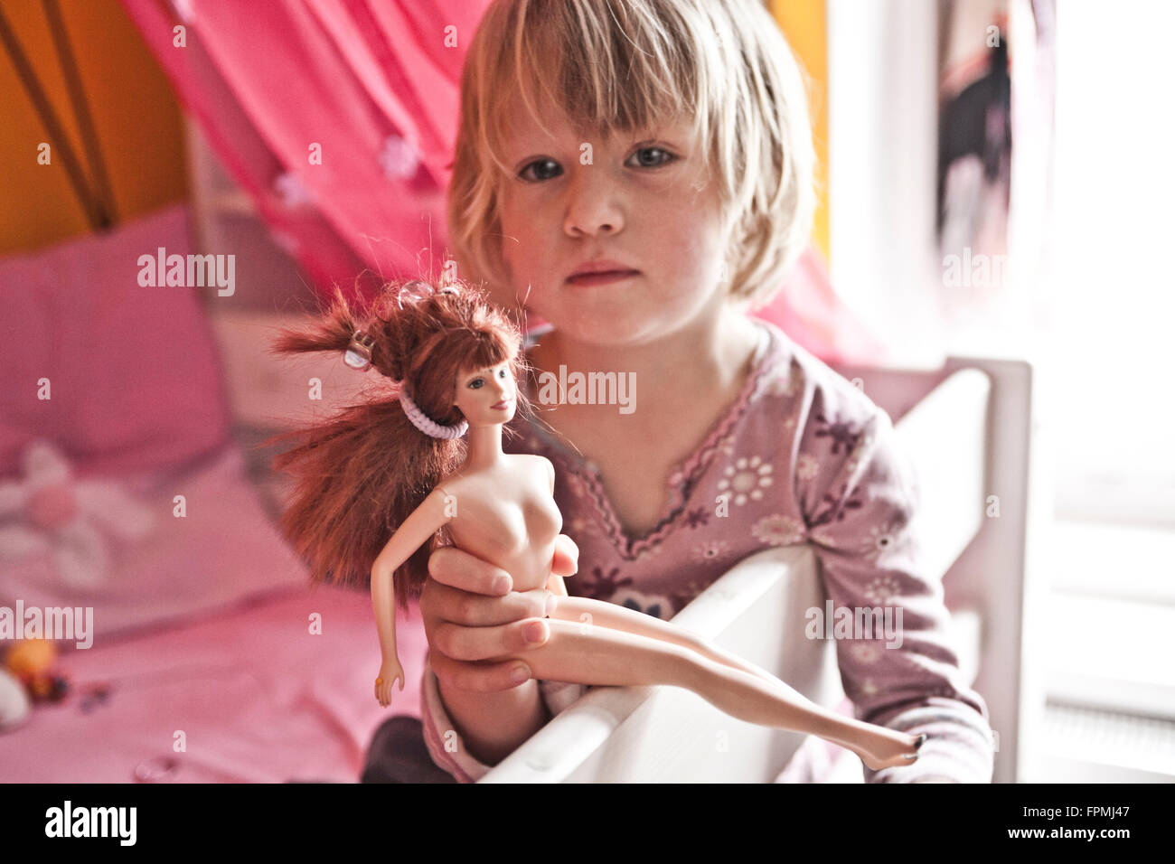 Child with doll Stock Photo - Alamy