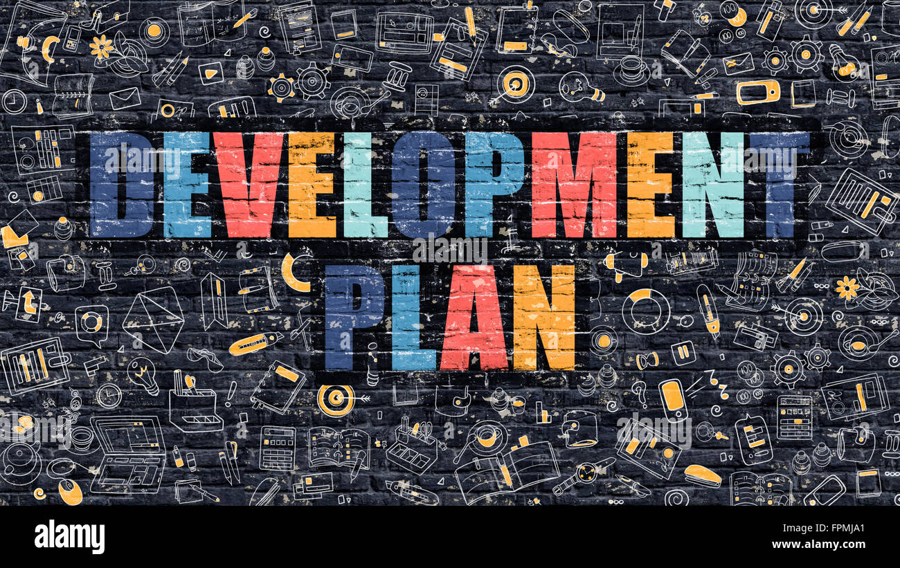 Development Plan on Dark Brick Wall Stock Photo - Alamy