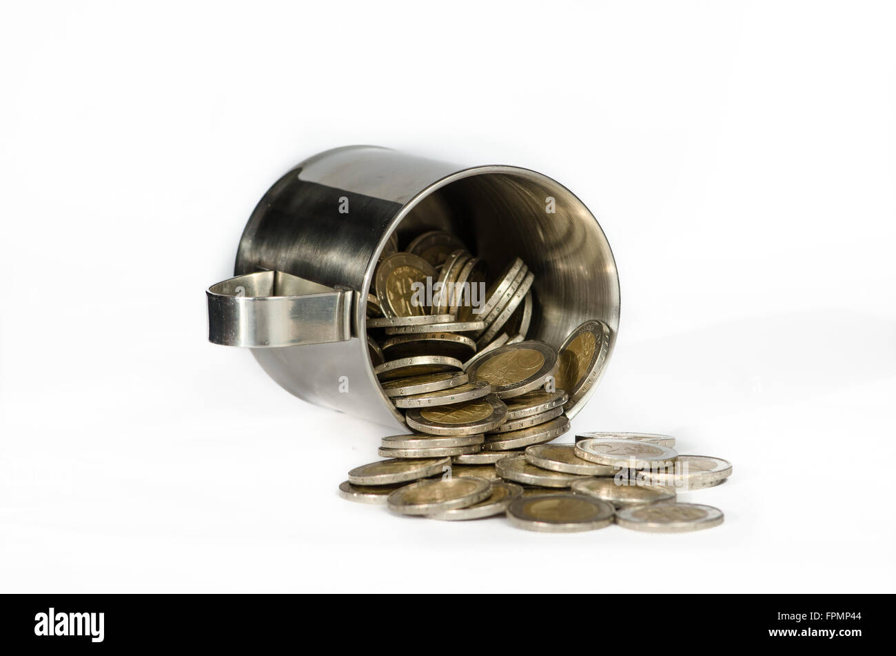 coins in glass on white background Stock Photo - Alamy