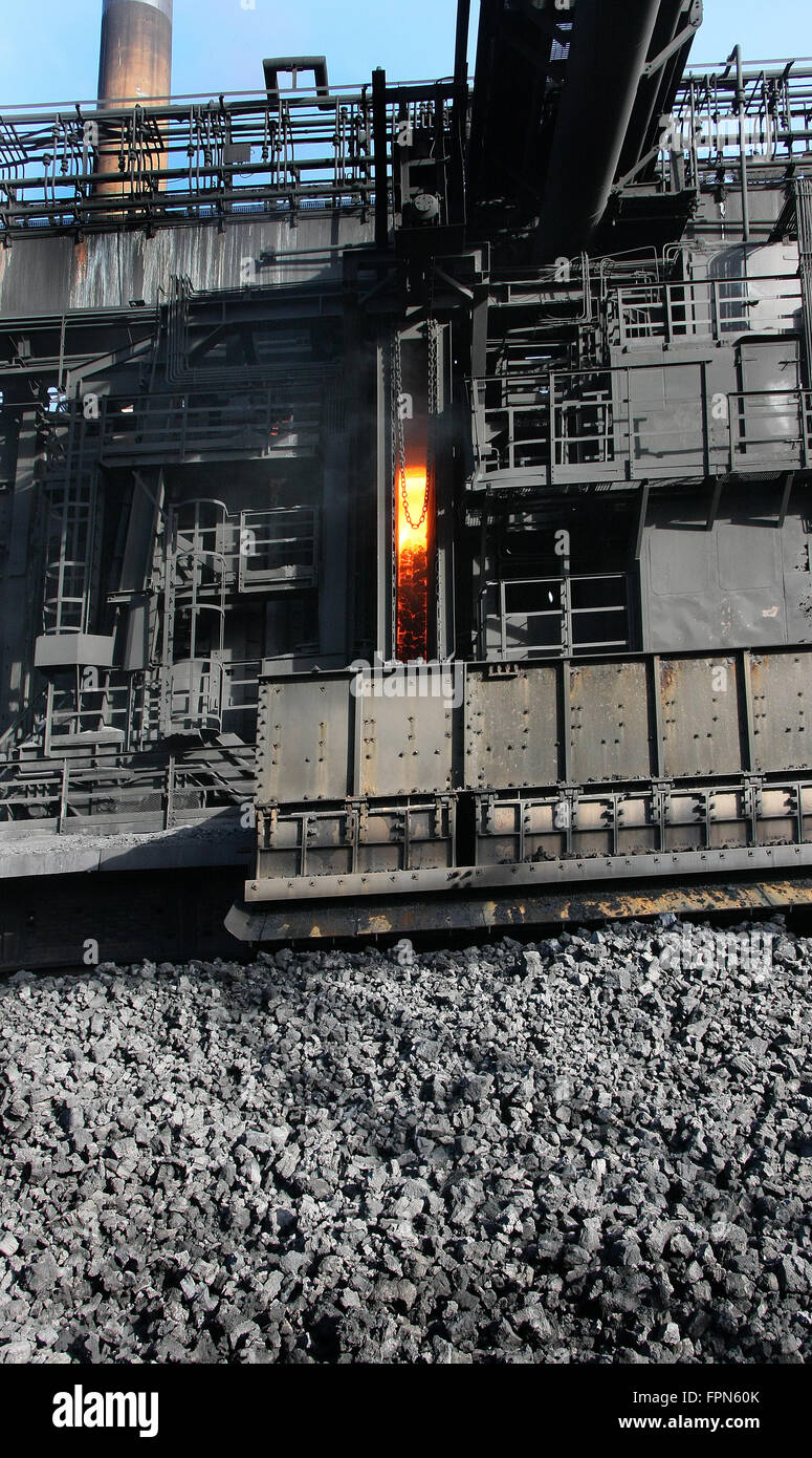 Pushing red hot coke from oven Stock Photo - Alamy