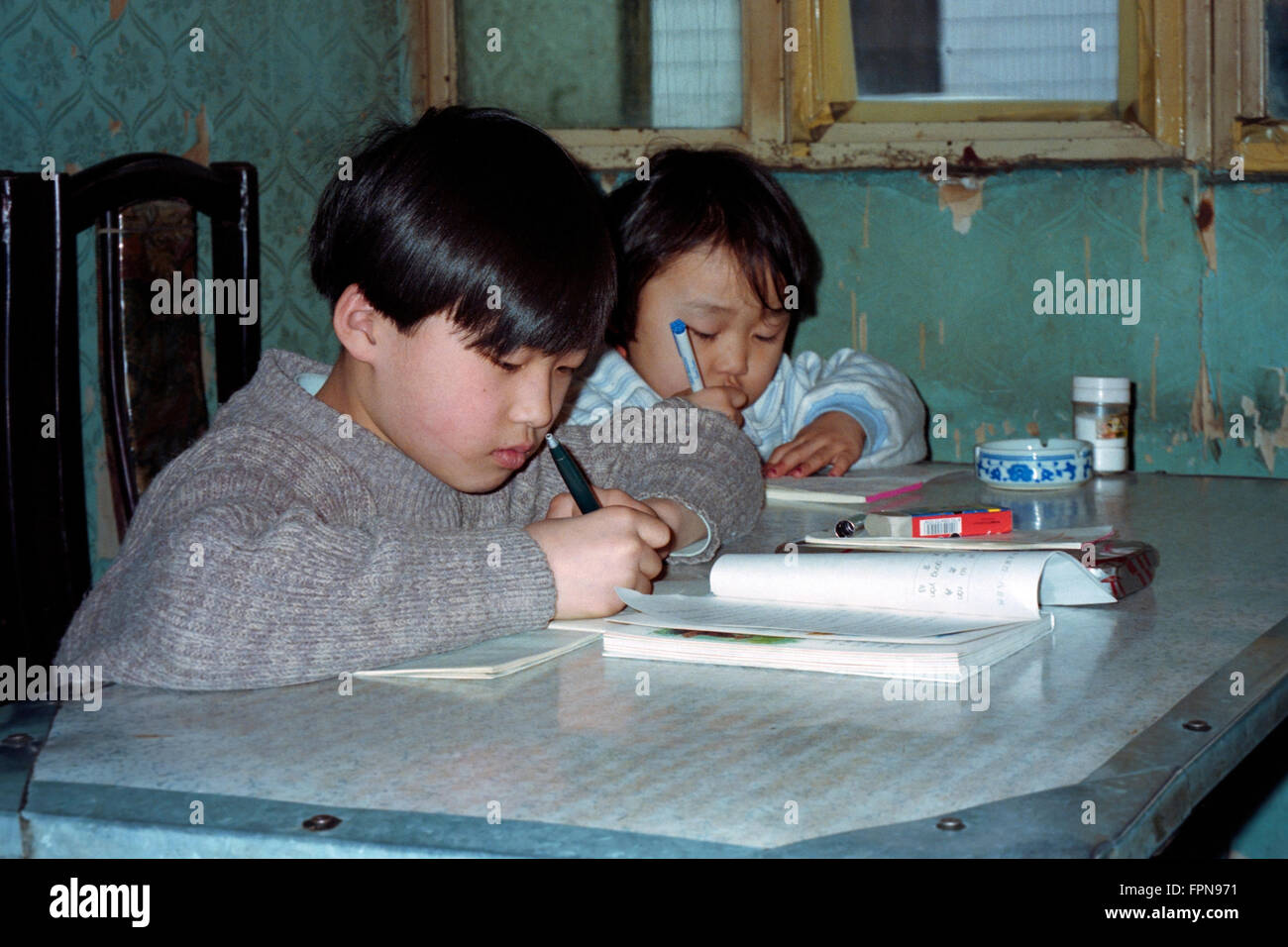 youngsters doing their homework in a restaurant in beijing china Stock ...