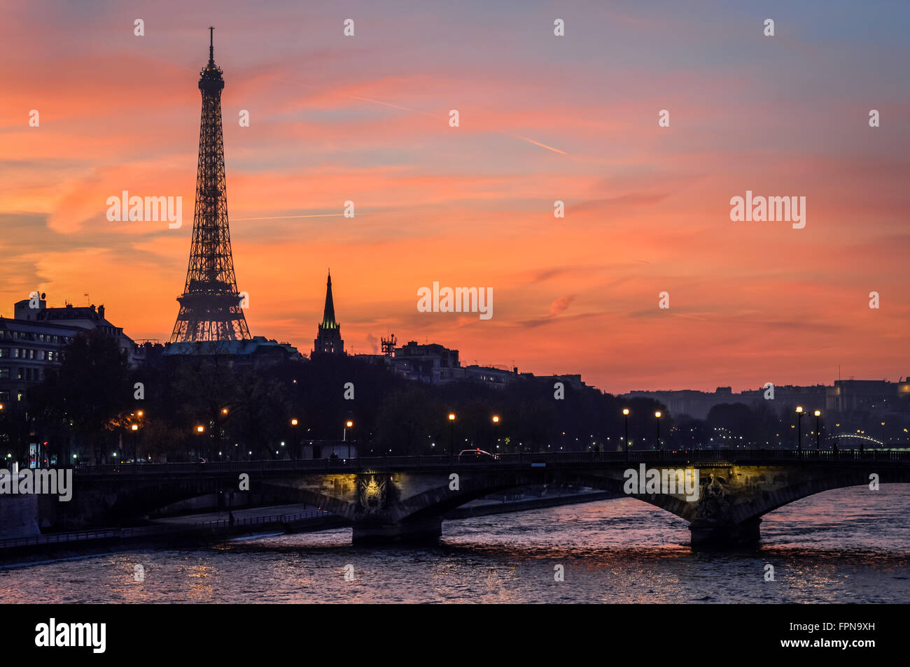 Colorful sunset in Paris with Eiffel Tower and Alexander III bridge ...