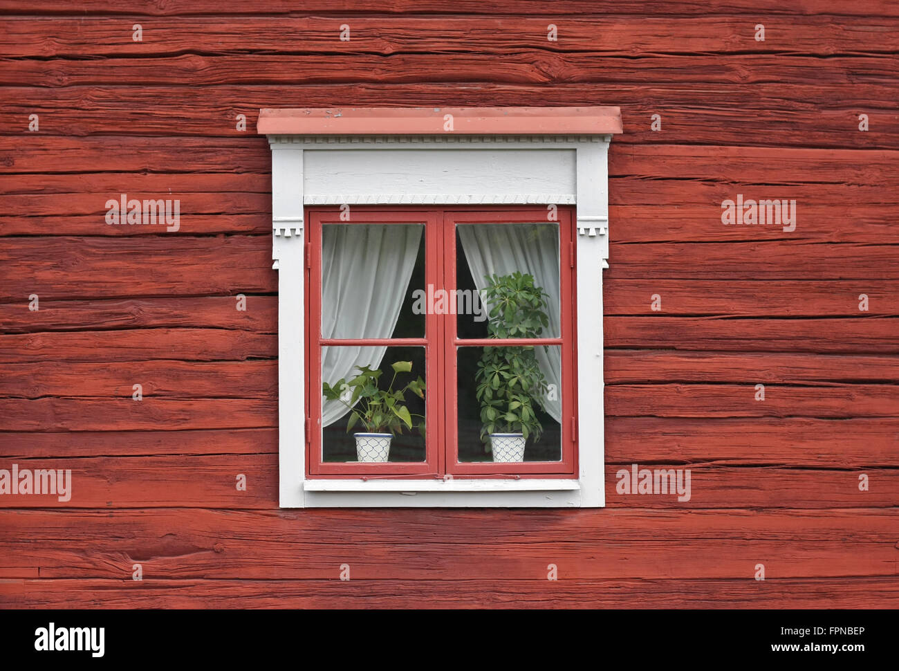 Cute window on traditional red Swedish house wall Stock Photo - Alamy