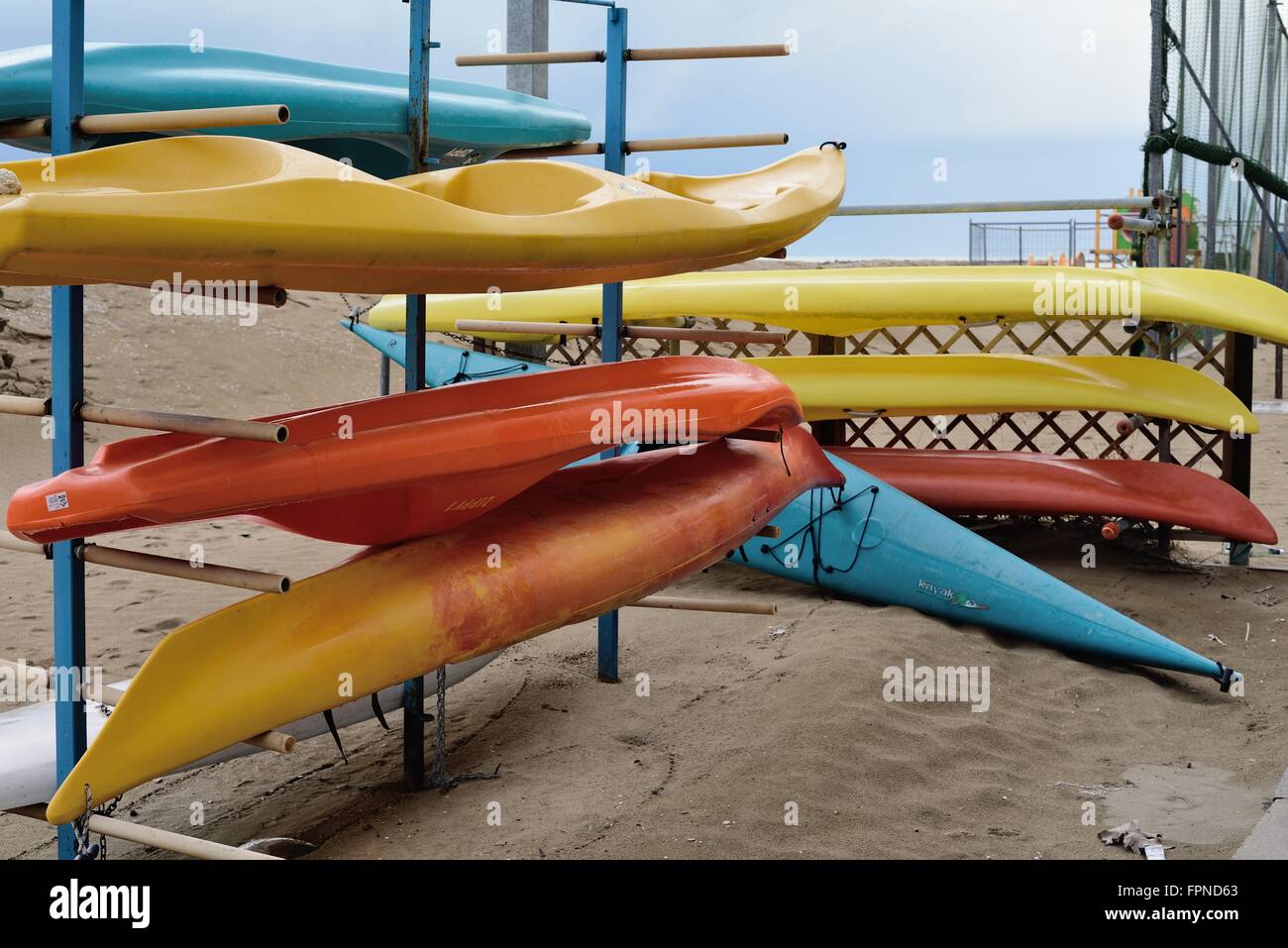 Stacked canoes on the beach in wintertime Stock Photo - Alamy