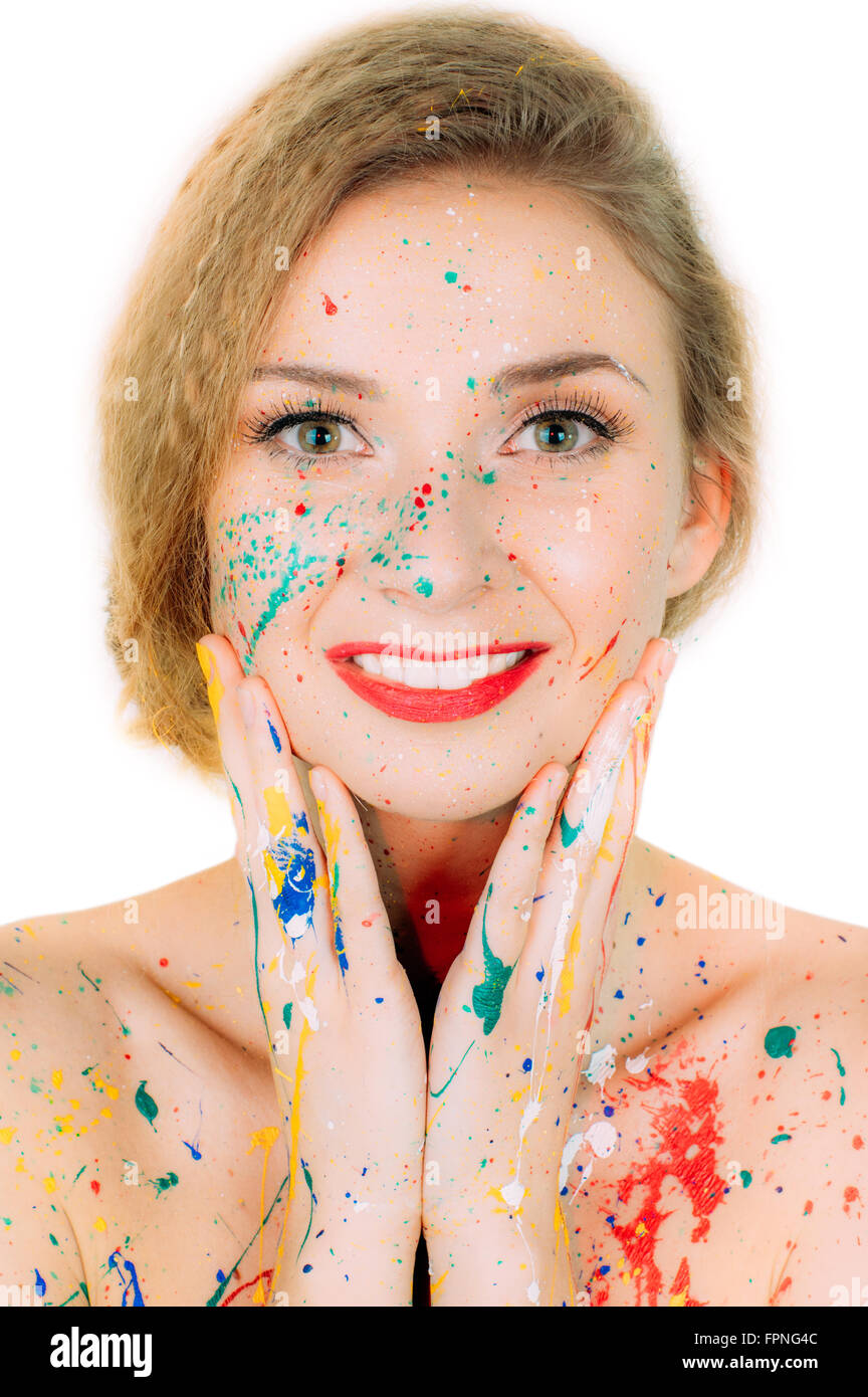Colorful portrait of young smiling woman in paint with red lips ...