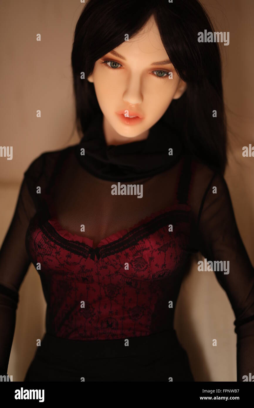 Life-Size silicone doll in in see through top and reddish torselett ...