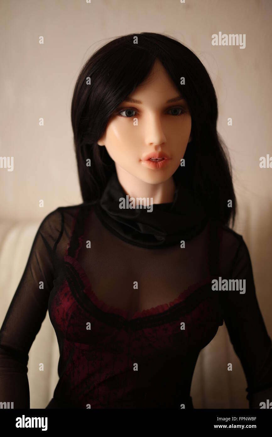 Life-Size silicone doll in in see through top and reddish torselett ...