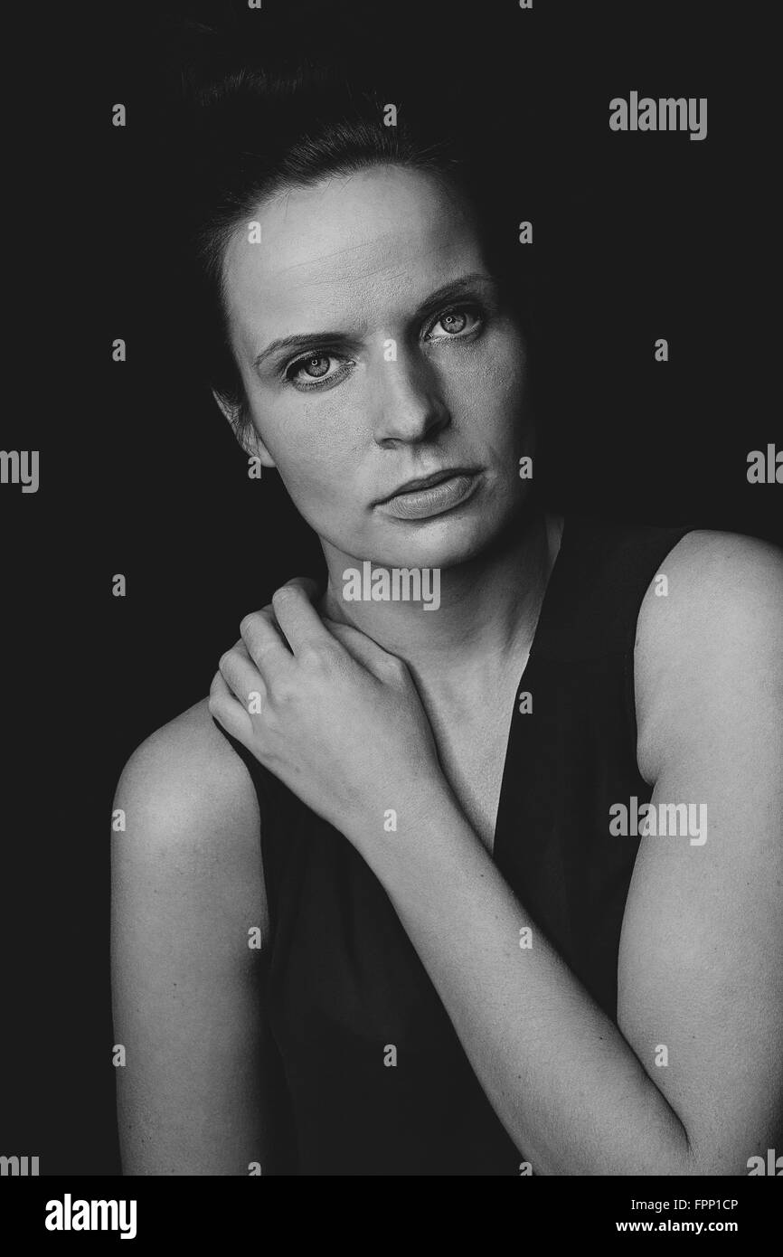 Young woman looking questioningly at camera Stock Photo - Alamy