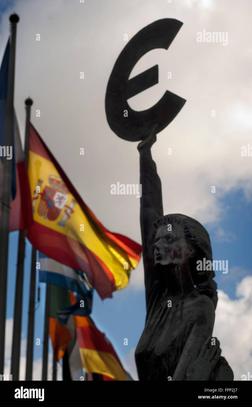 Spanish flag and Euro symbol at European Parliament building in ...