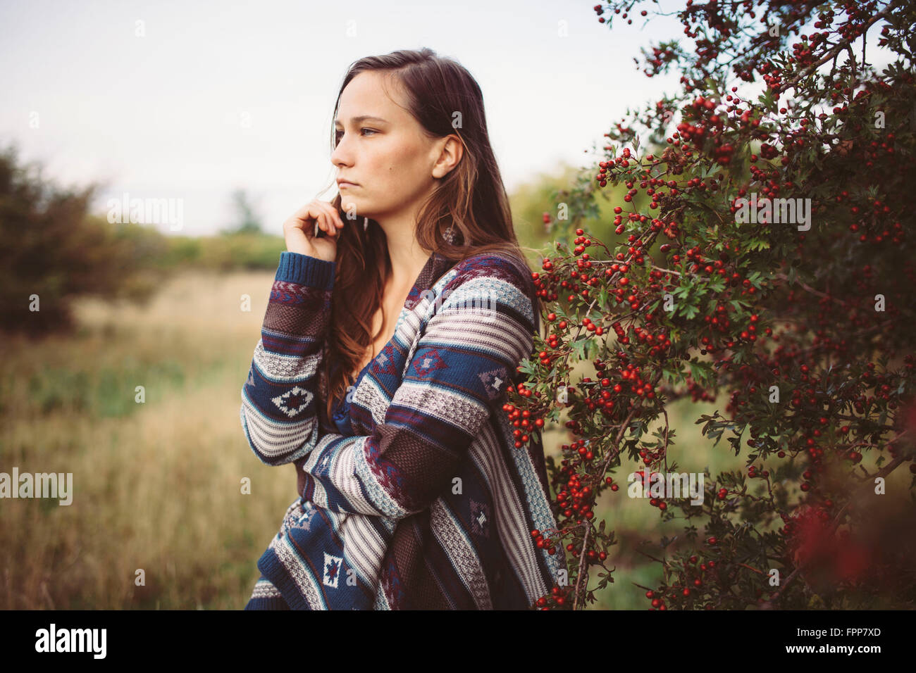 Woman standing in nature and thinking Stock Photo - Alamy