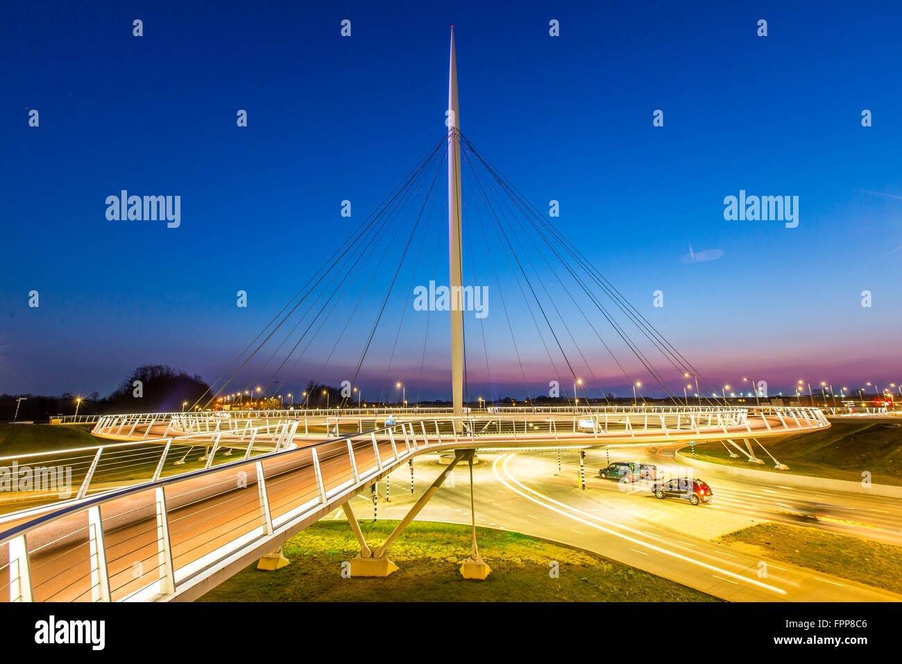 The Hovenring, a roundabout for cyclists, hanging over a busy street ...