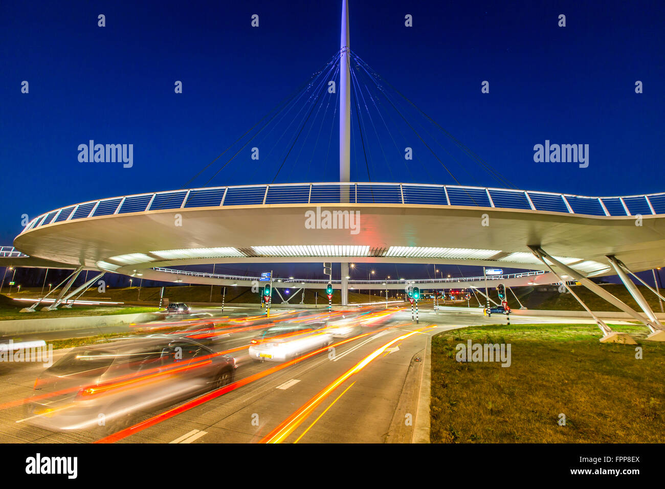 The Hovenring, a roundabout for cyclists, hanging over a busy street ...