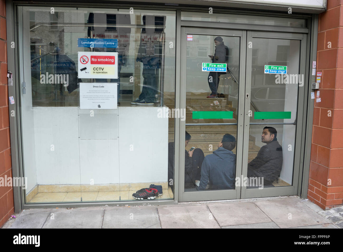 Muslim men talking at the East London Mosque at Whitechapel in London ...