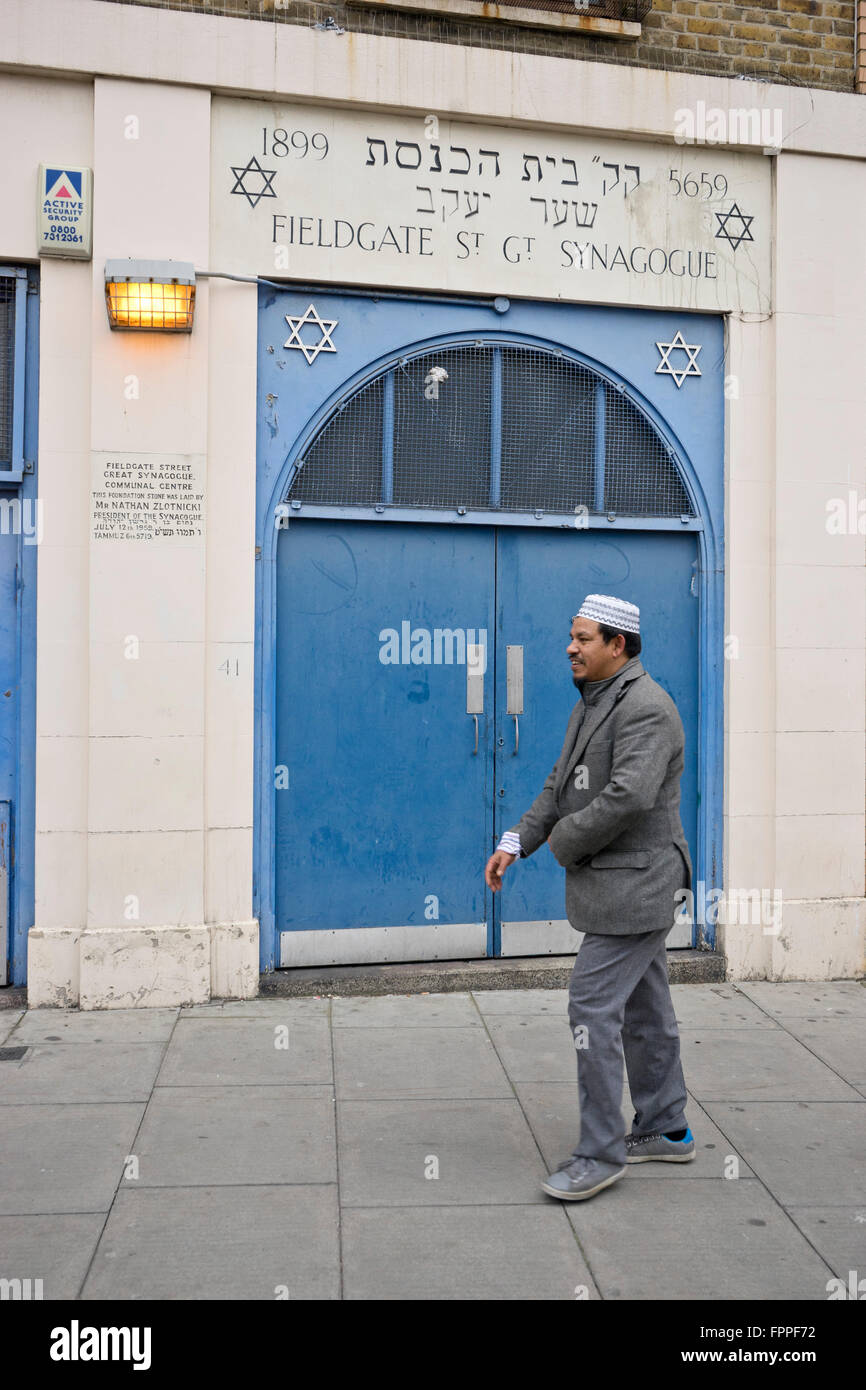Muslim man walk past the Jewish Fieldgate St. Grand Synagogue next to ...