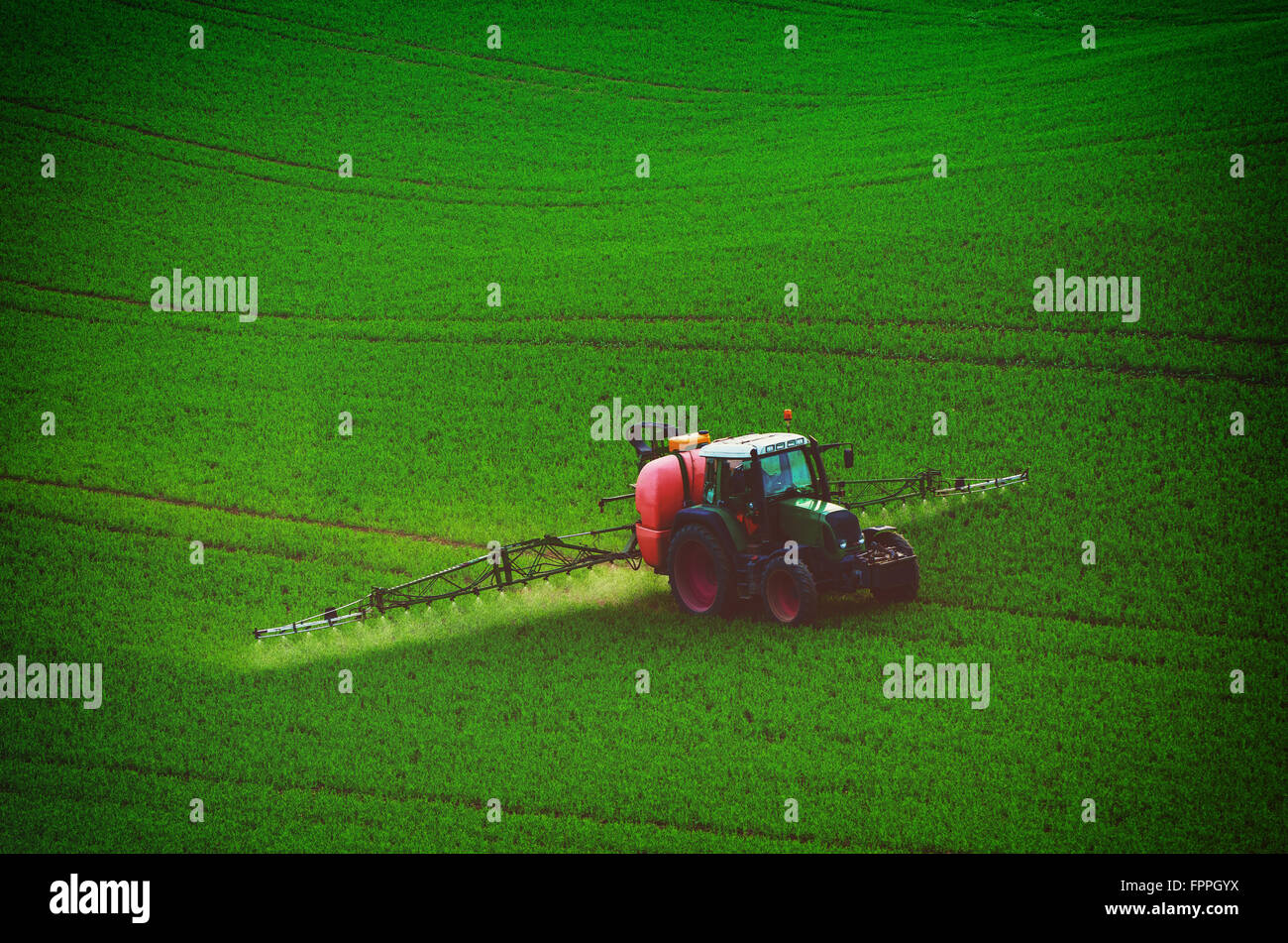 Farm machinery spraying insecticide Stock Photo - Alamy