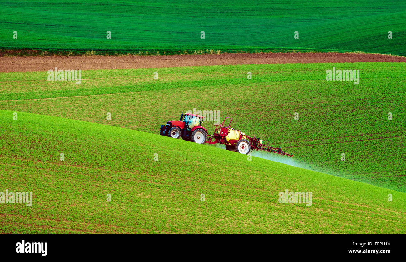 Farm machinery spraying insecticide Stock Photo - Alamy