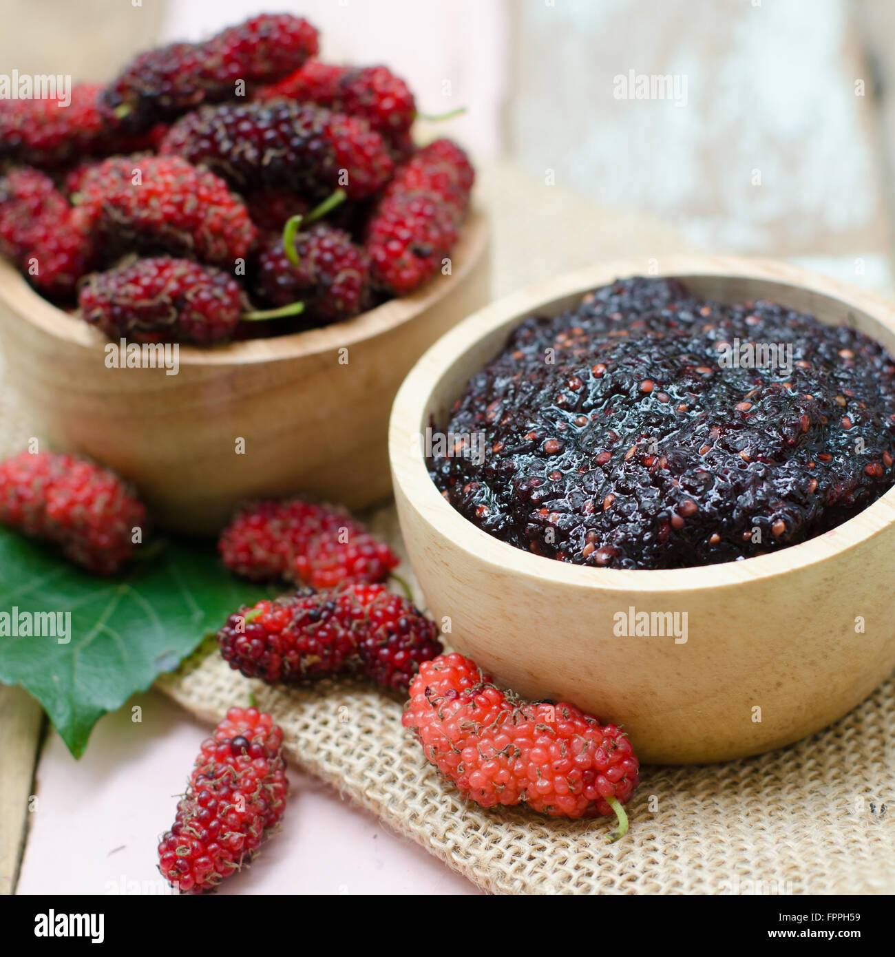 home made mulberry jam in wooden bowl and some fresh fruits and Stock ...
