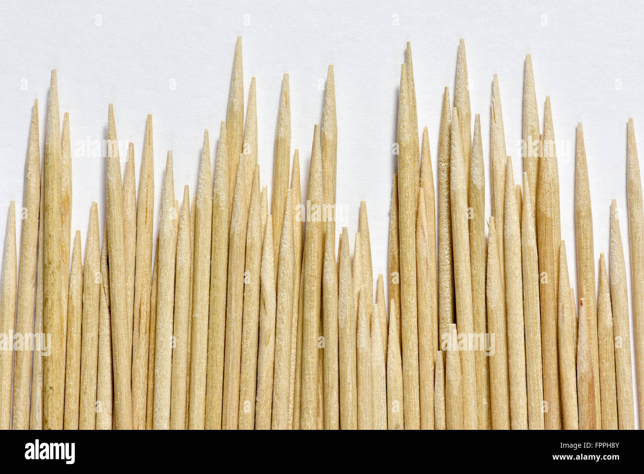 Cocktail sticks on white background Stock Photo - Alamy