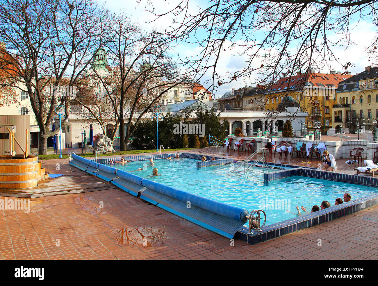 People enjoy an outdoor thermal pool in the Gellert Medicinal Bath ...