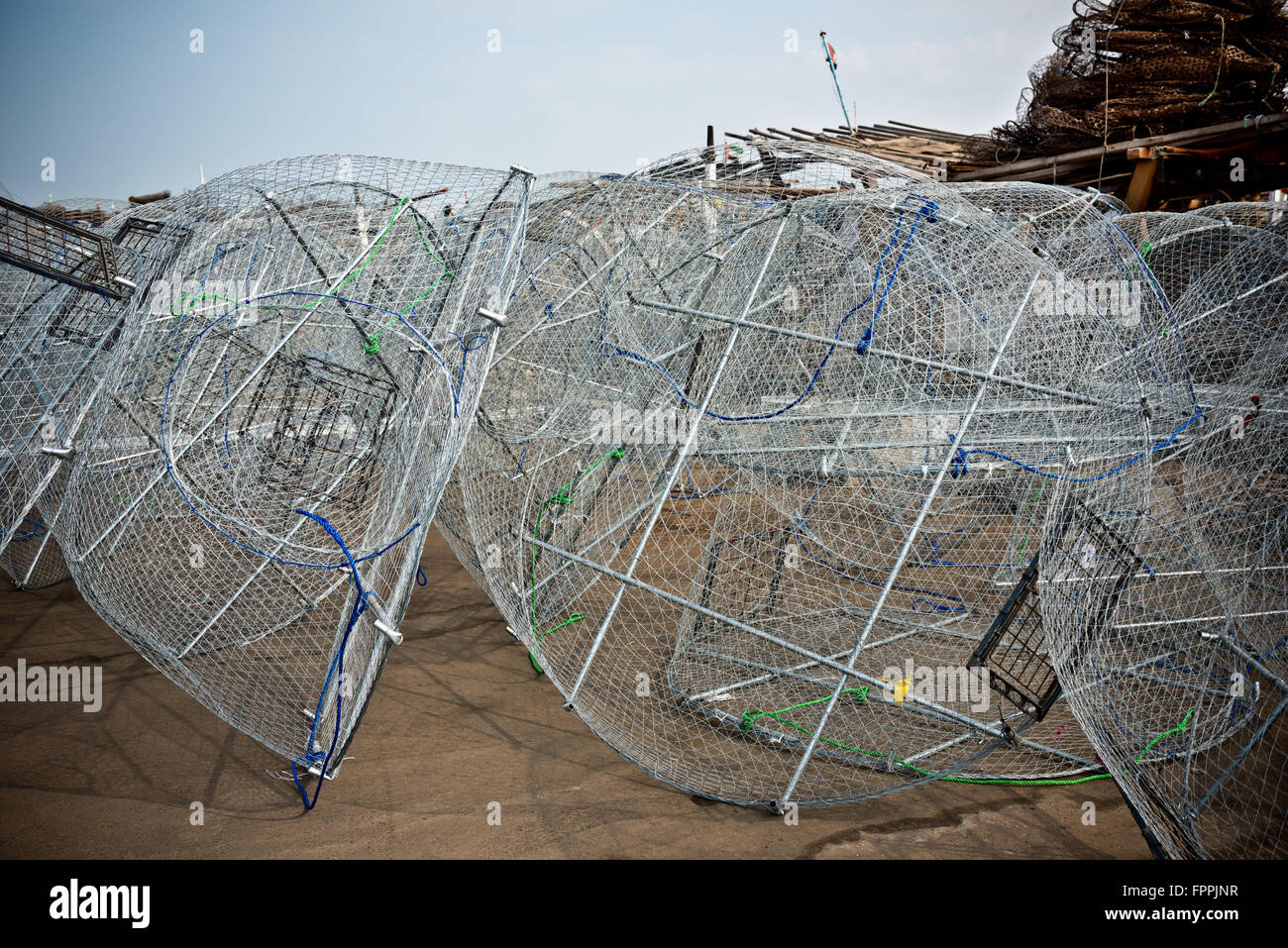 Metal fishing nets in a port. Horizontal shot Stock Photo - Alamy