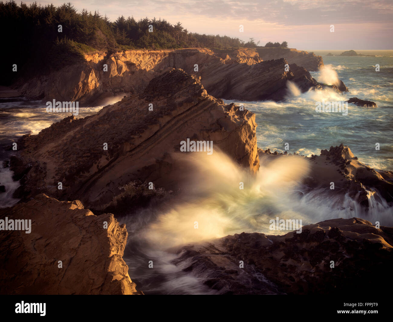 Waves and setting sun at Shore Acres State Park, Oregon Stock Photo - Alamy