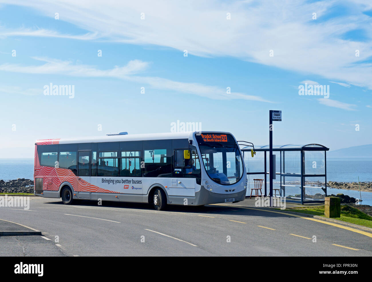 Bus at bus stop, in the village of Blackwaterfoot, Isle of Arran, North ...