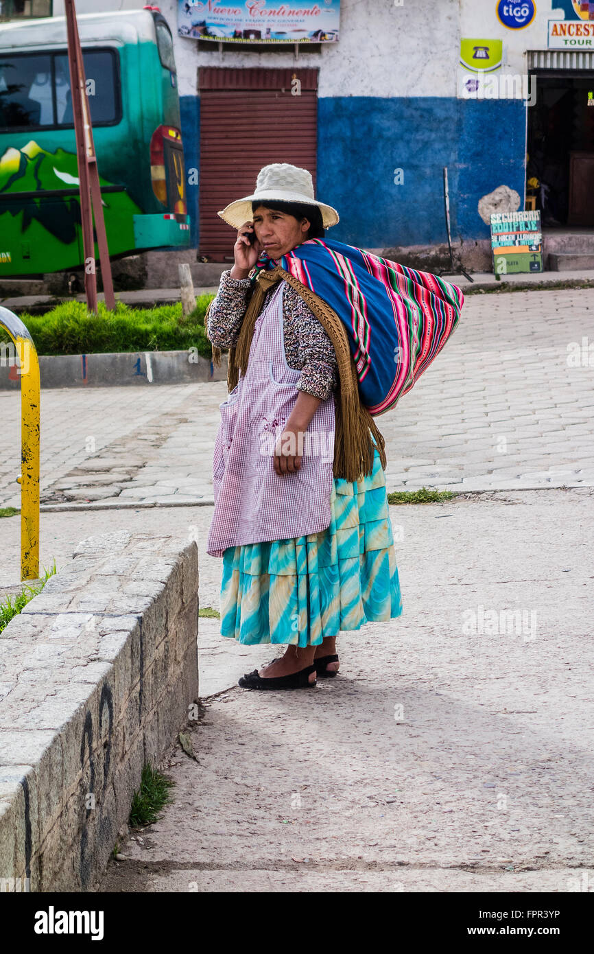 Indigenous women on cell phone in traditional dress in Cochabamba ...