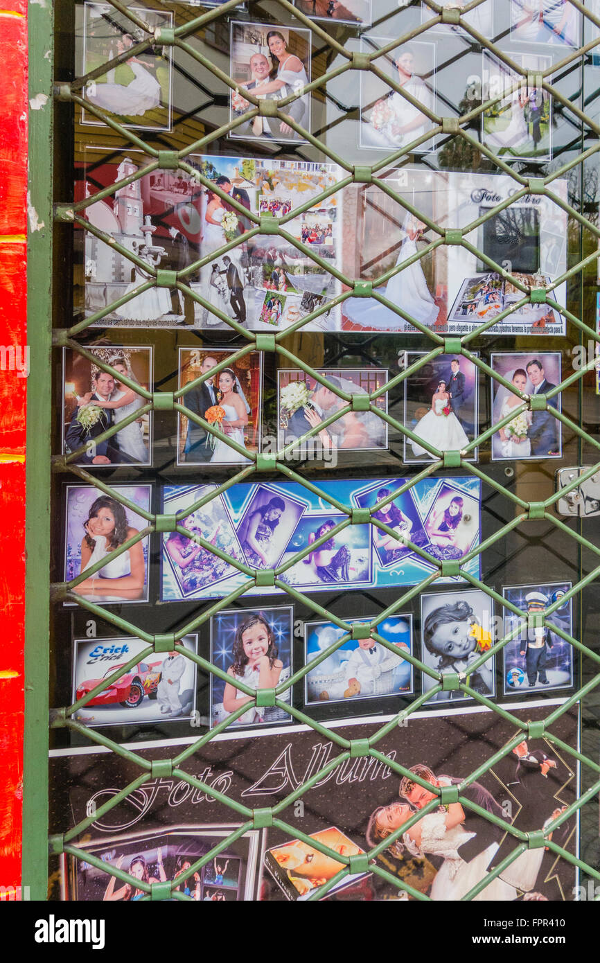 Photographer's shop window covered by a metal security screen with ...