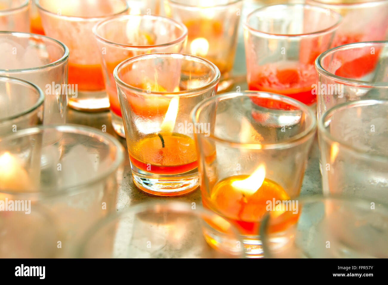fire burning candles in many glass Stock Photo - Alamy