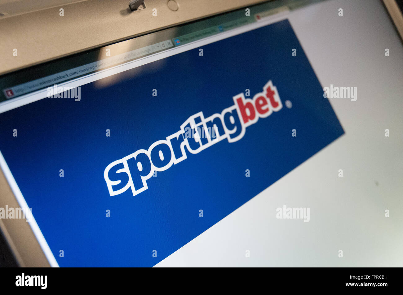 Sporting bet screen displayed in shop with 20 pounds notes in front ...