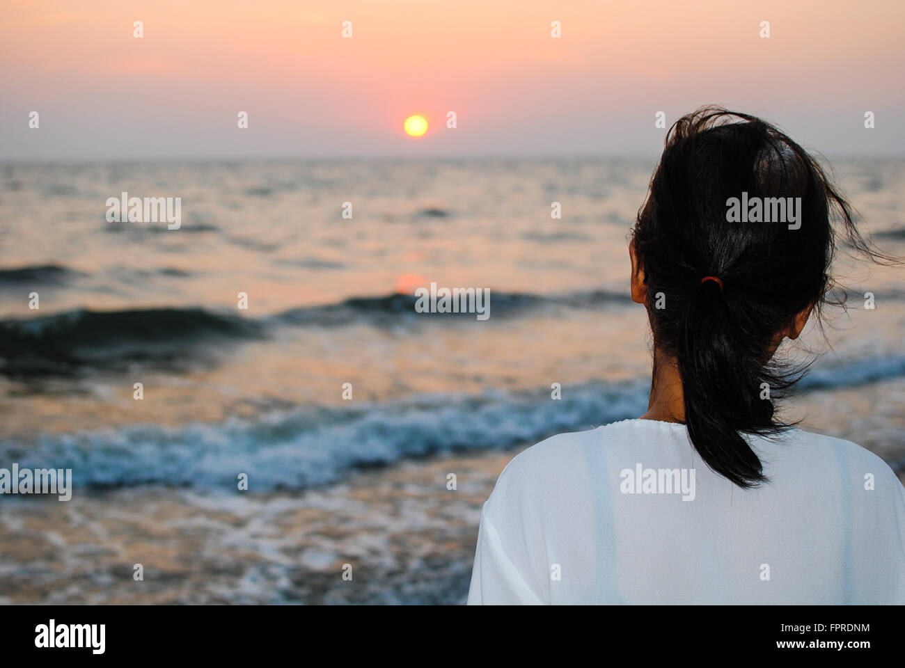 Lady looking out to sea in Thailand Stock Photo - Alamy