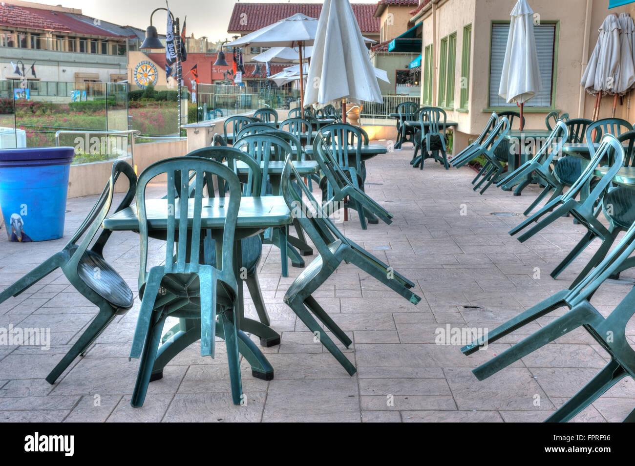 Patio restaurant sitting empty in early morning Stock Photo - Alamy