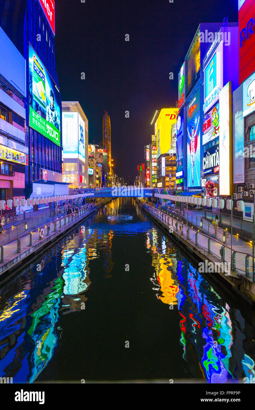 Bright illuminated signs on banks of Dotonbori canal at night in Namba ...