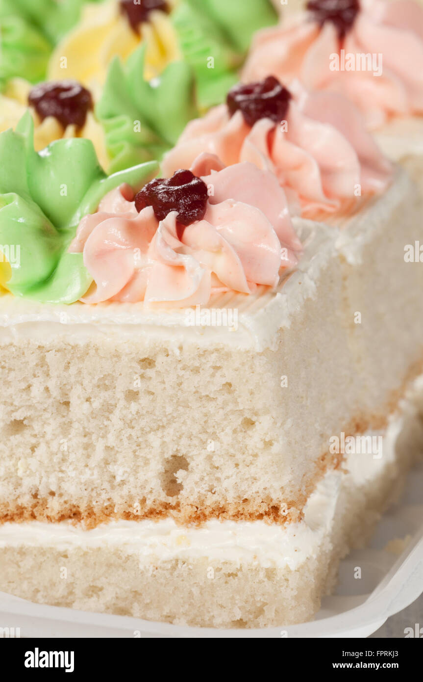 Angel cake with cream flowers, close up Stock Photo - Alamy