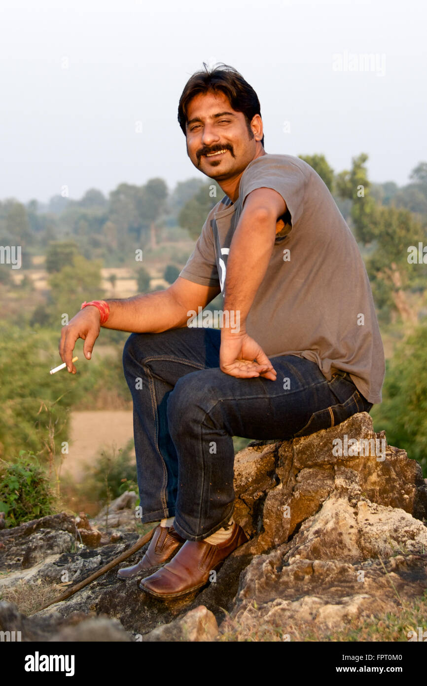 Indian smoking and smiling Stock Photo - Alamy